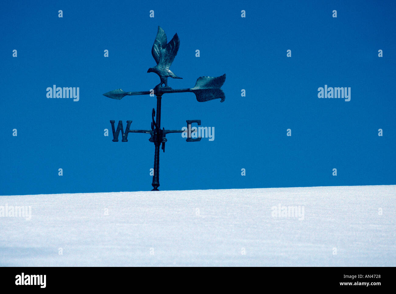 Weather vane on snowy roof hi-res stock photography and images - Alamy
