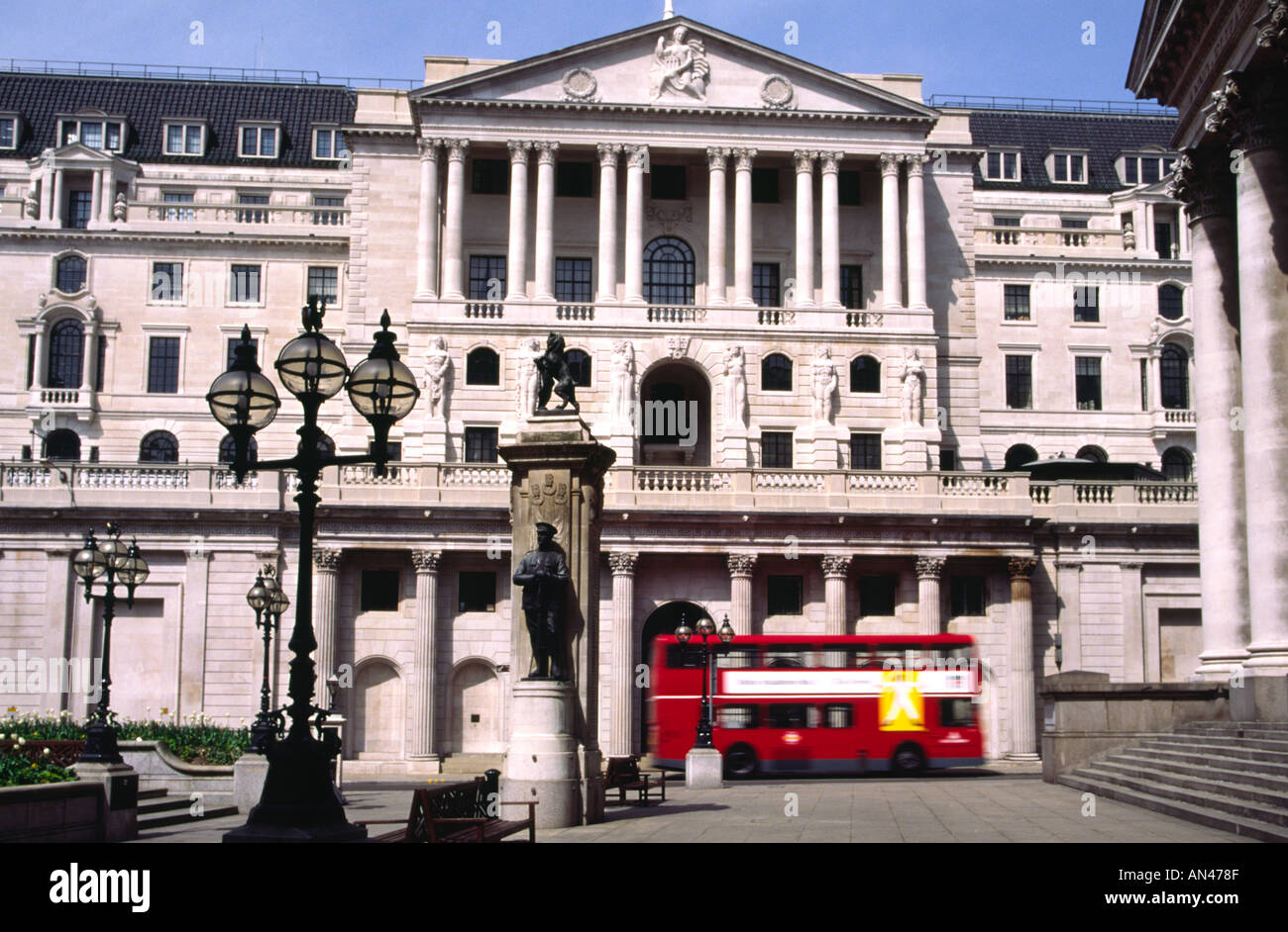 Red bus passing the Bank of England in Threadneedle Street London Stock ...