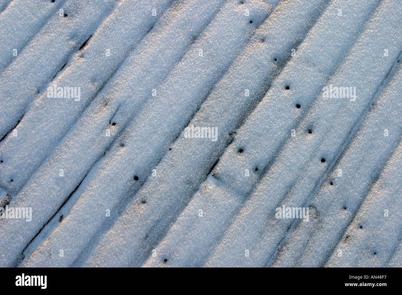 Wooden boarding covered with fresh new snow Stock Photo - Alamy
