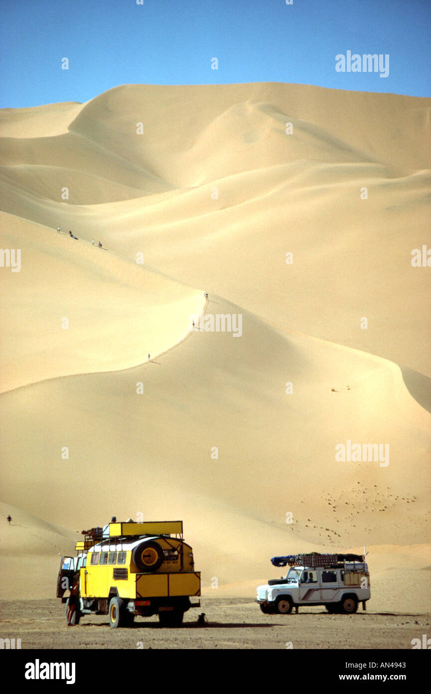 Four wheel drive vehicles and sand dunes Sahara Desert Algeria North ...