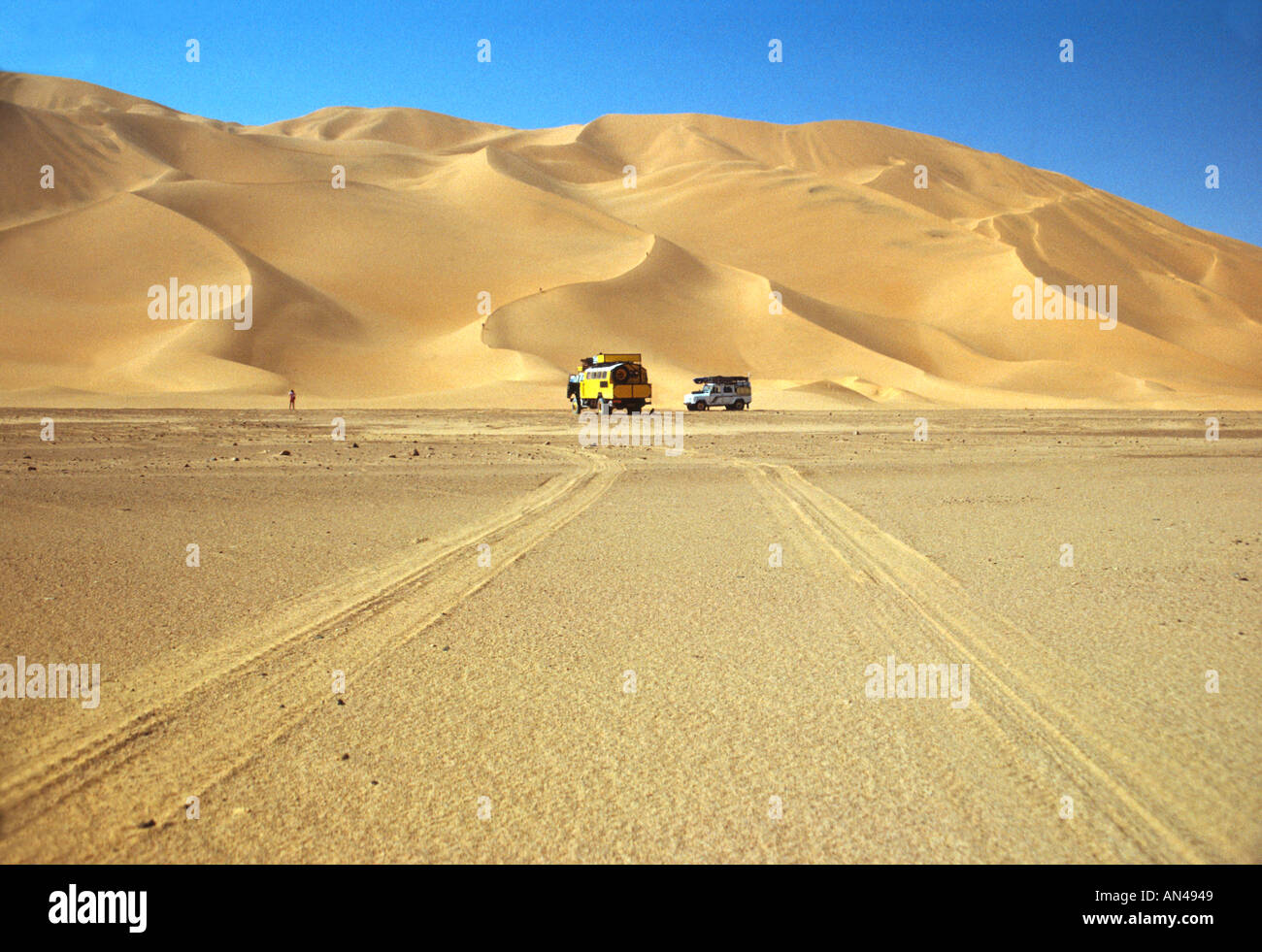 Four wheel drive vehicles and sand dunes Sahara Desert Algeria North ...
