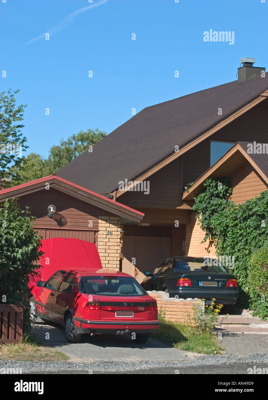 Detached house with two parked cars , Finland Stock Photo - Alamy