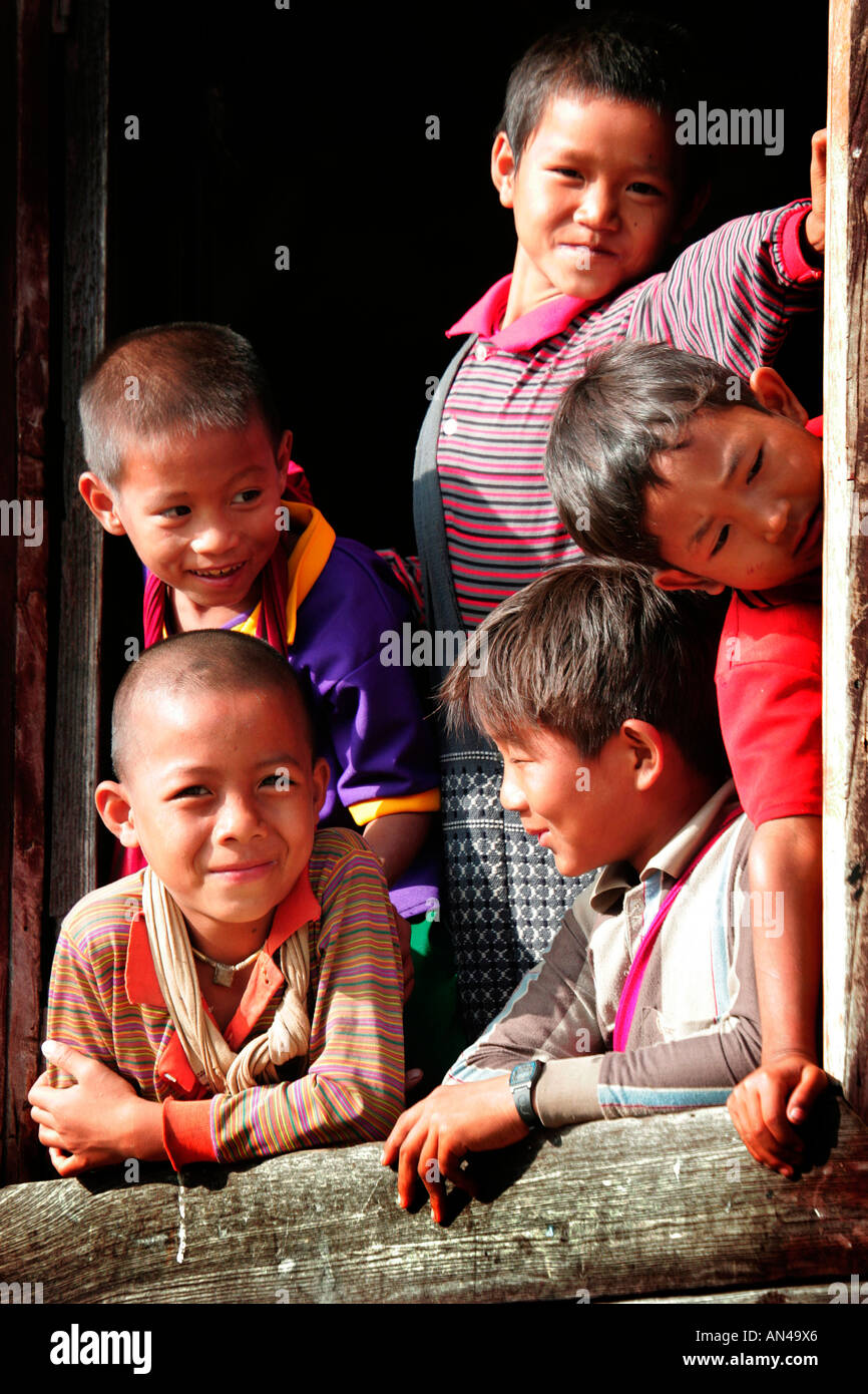 Burmese children at a window of Shwe Yaunghwe Monastery, near ...