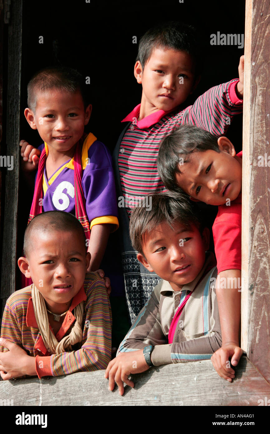 Burmese children at a window of Shwe Yaunghwe Monastery, near ...
