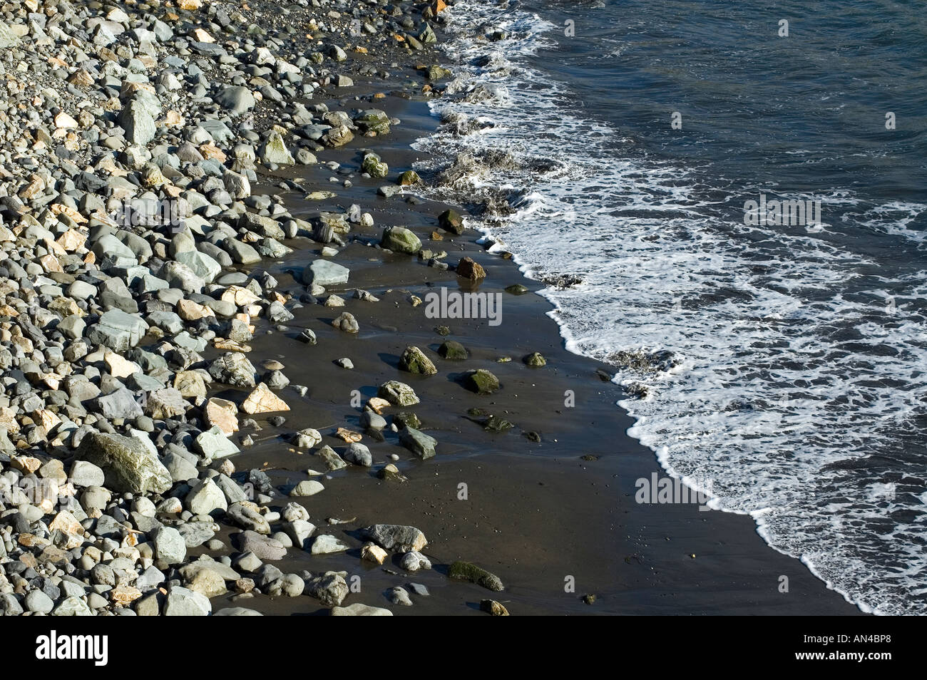 Wave washed pebbles hi-res stock photography and images - Alamy