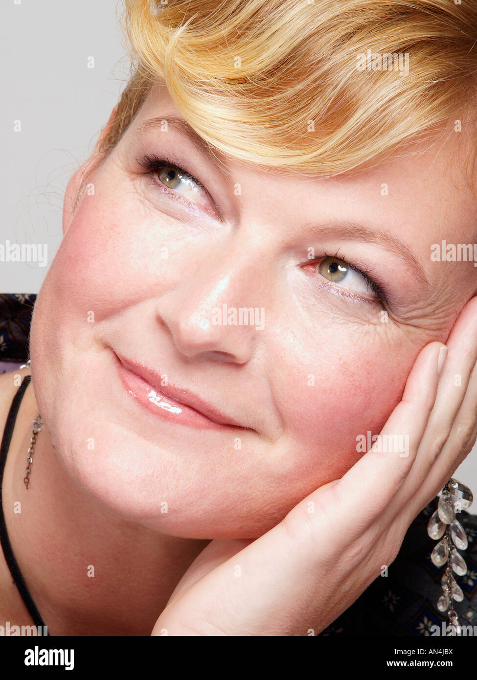 Woman thinking skincare smile hi-res stock photography and images - Alamy