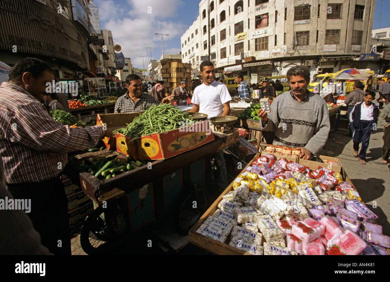 Market stall holders in busy street market, Hebron, West Bank ...