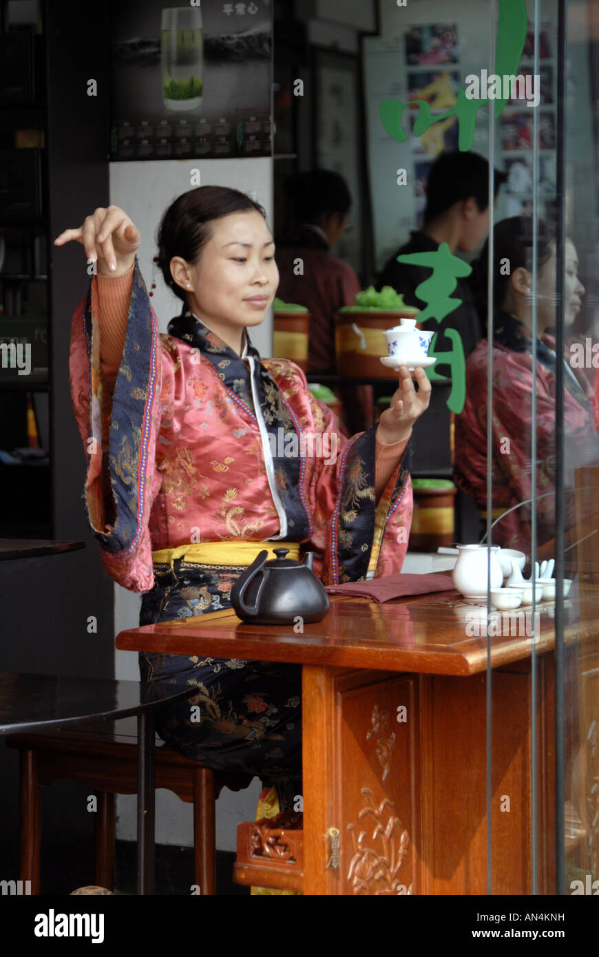 Lady performing tea ceremony in Qintai Road Chengdu China Stock Photo ...