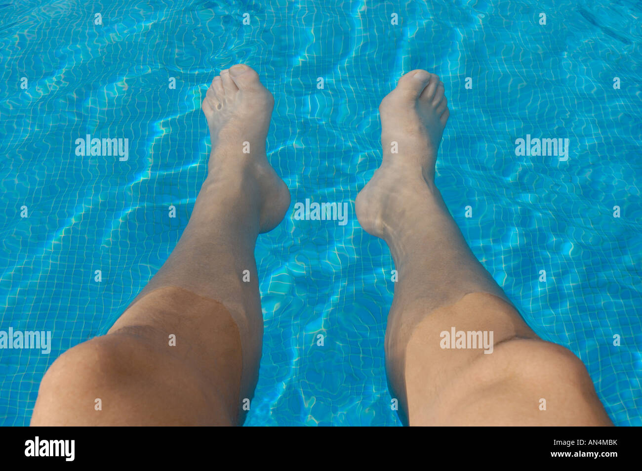 legs in swimming pool Stock Photo - Alamy