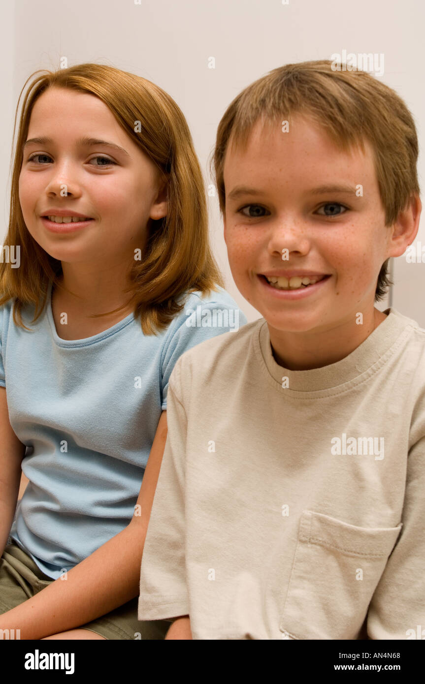 Portrait of two young kids smiling Stock Photo - Alamy