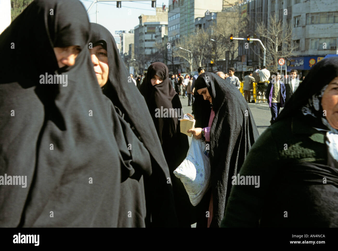 Burqa clad women on a street in Tehran Iran Stock Photo - Alamy