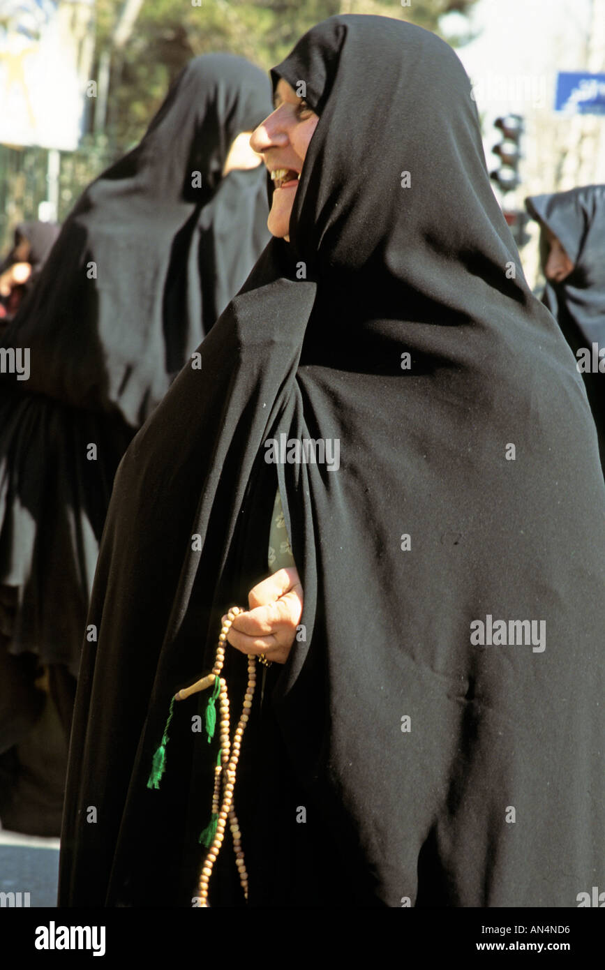 A burqa clad woman holding prayer beads in Tehran Iran Stock Photo - Alamy