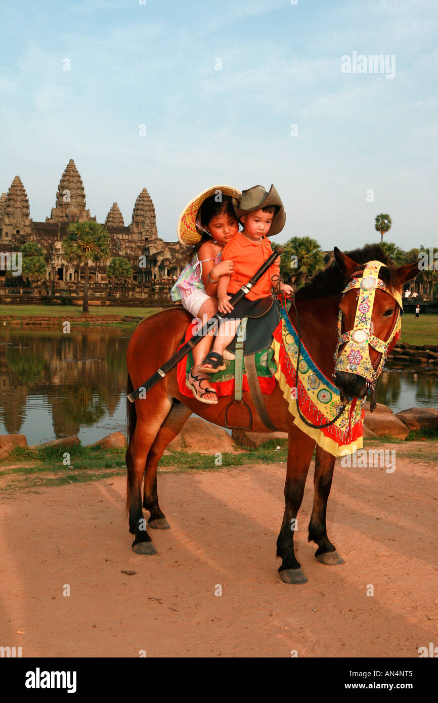 Khmer children posing on a horse at Angkor Wat, Siem Reap, Cambodia ...