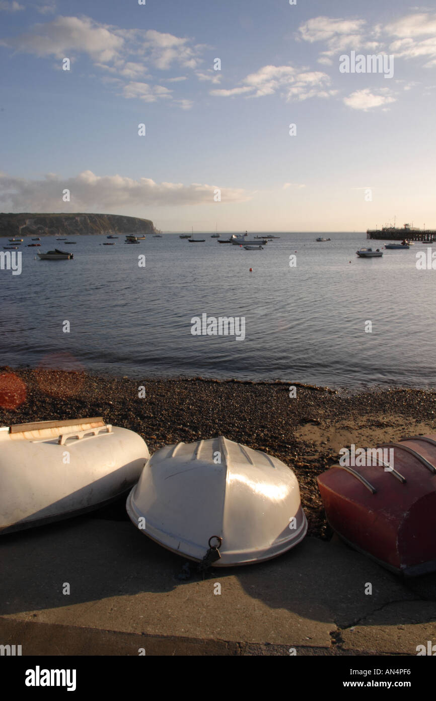 Rowing boats on beach at Swanage Harbour Stock Photo - Alamy