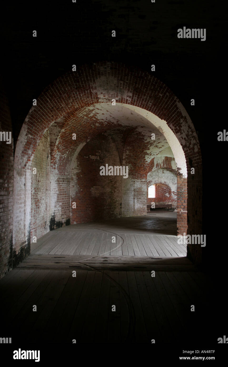 Arched passageway of brick dark framing with curve in passage Stock ...