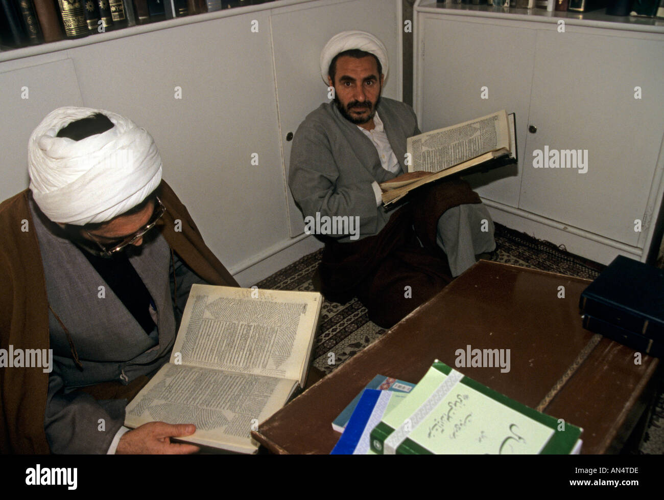 Two Muslim men studying Islamic scriptures in a library Stock Photo - Alamy