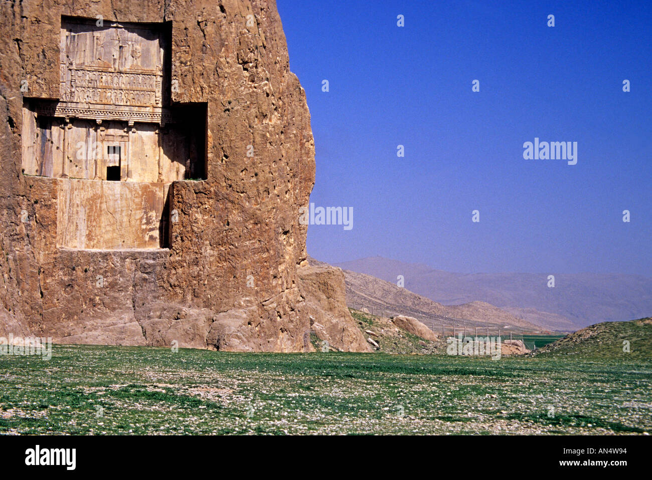 Landscape with cross shaped ancient Iranian rock reliefs cut into the ...