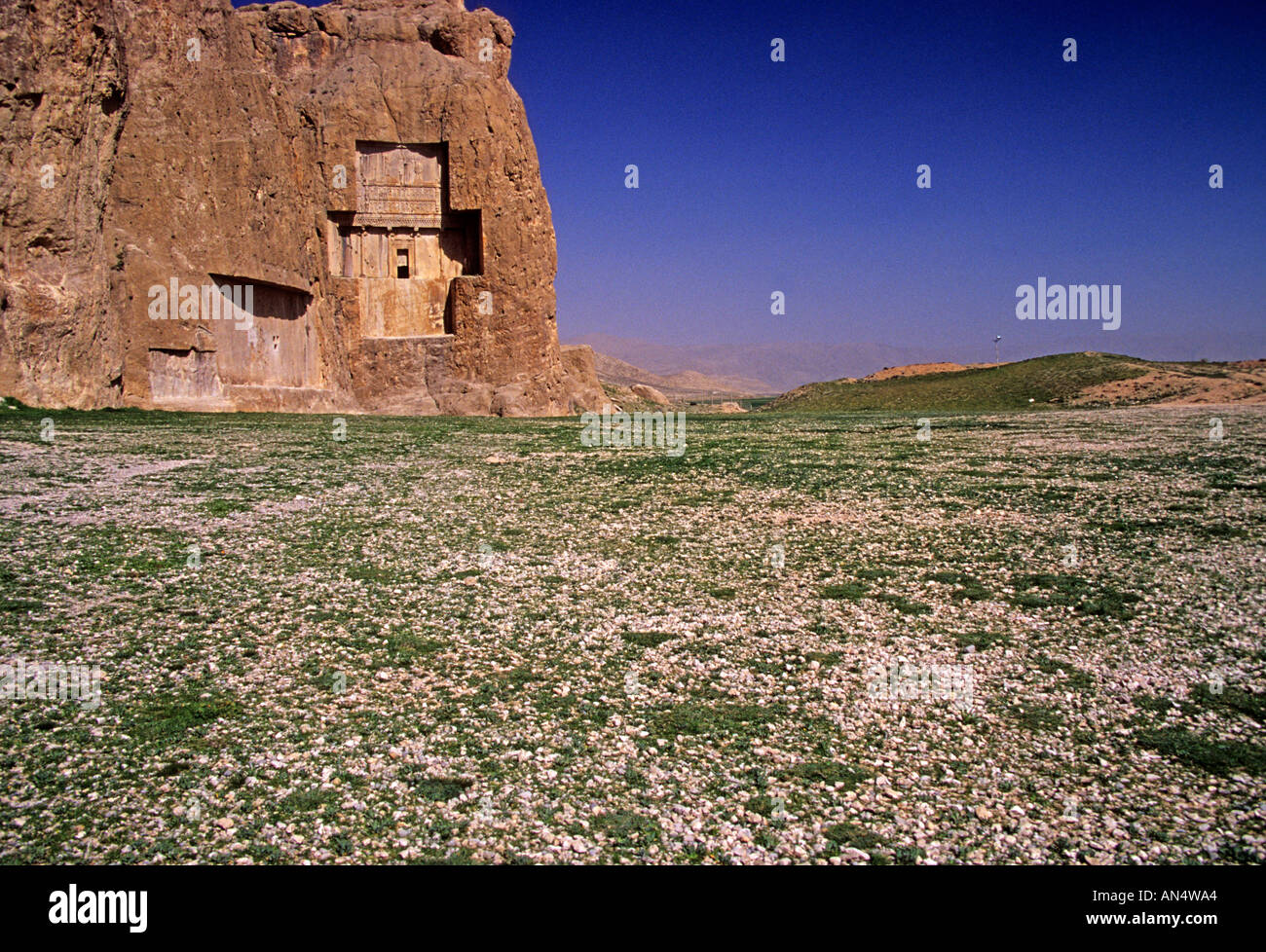 Landscape with cross shaped ancient Iranian rock reliefs cut into the ...