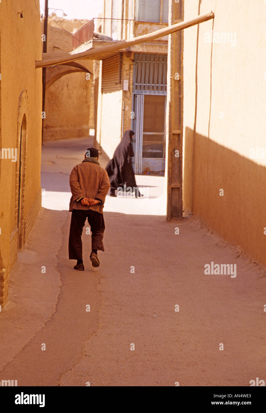 People walking along alleyway and street, Iran, Middle East Stock Photo ...