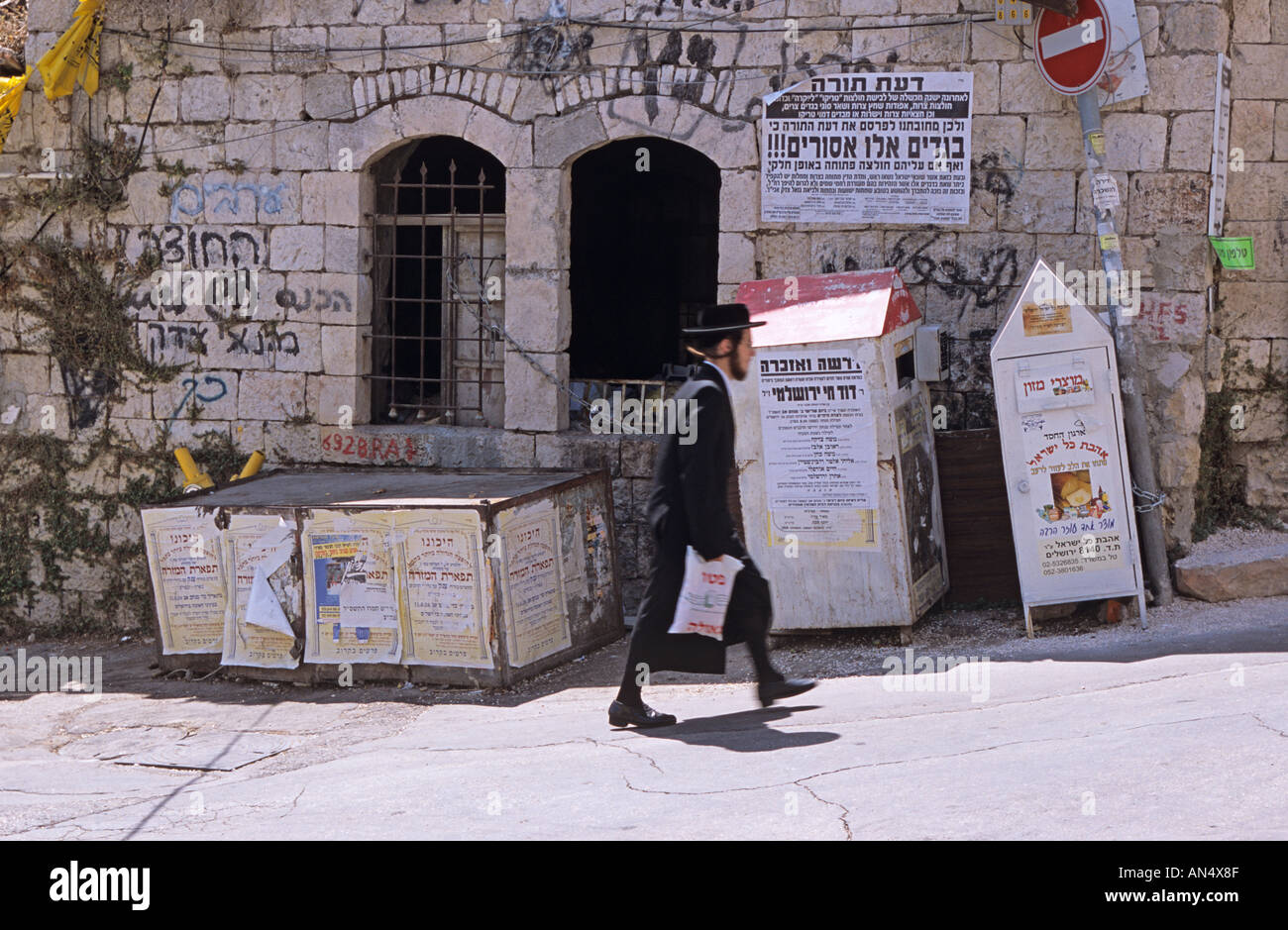 A man walks on a street in Mea Sharim Jerusalem Stock Photo - Alamy