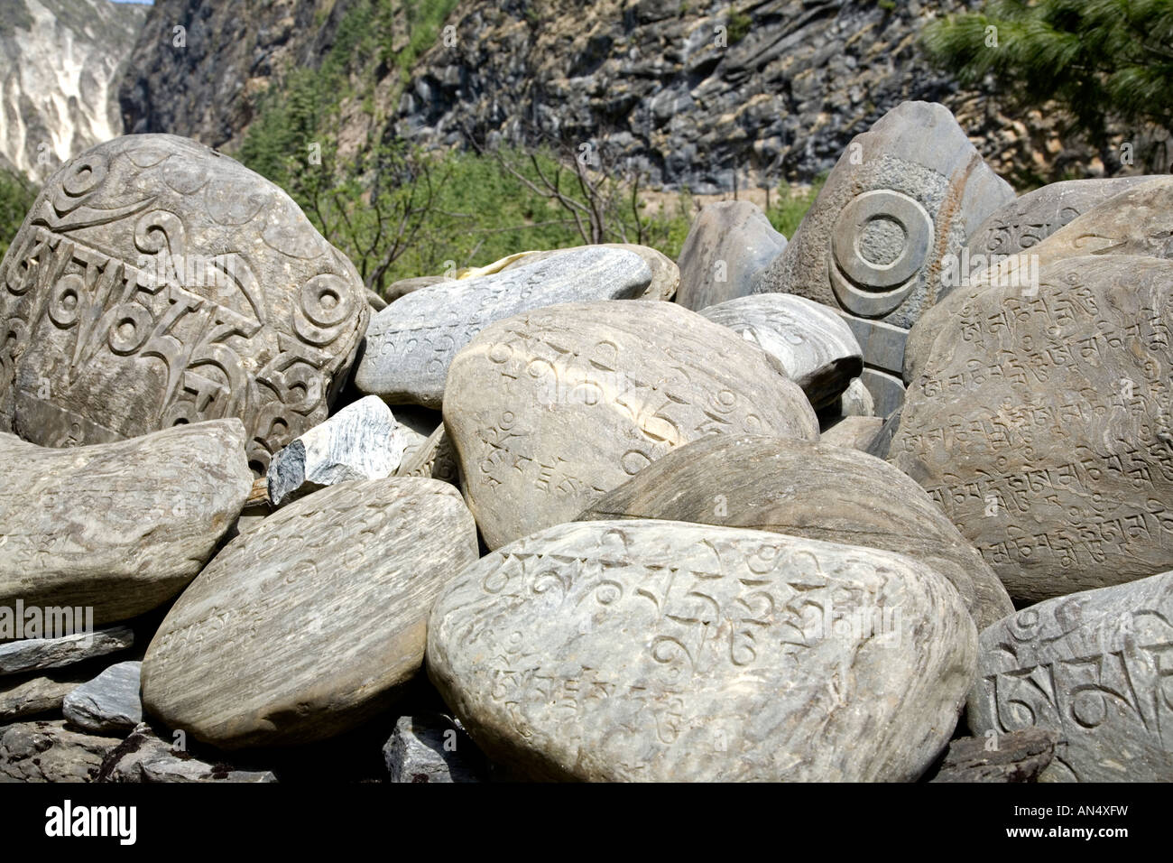 Stones with buddhist mantra om mani padme hum. Outside Khotro village ...