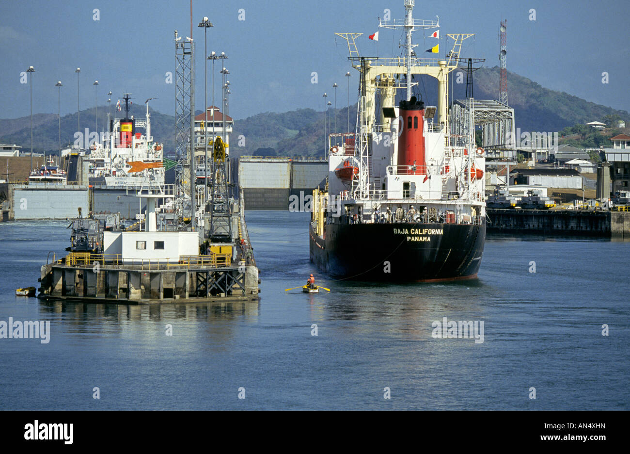 A small freighter ship makes a daylight passage through the Panama ...