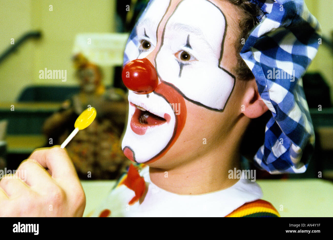 Portrait of clown with lollipop, London, England, UK Stock Photo - Alamy