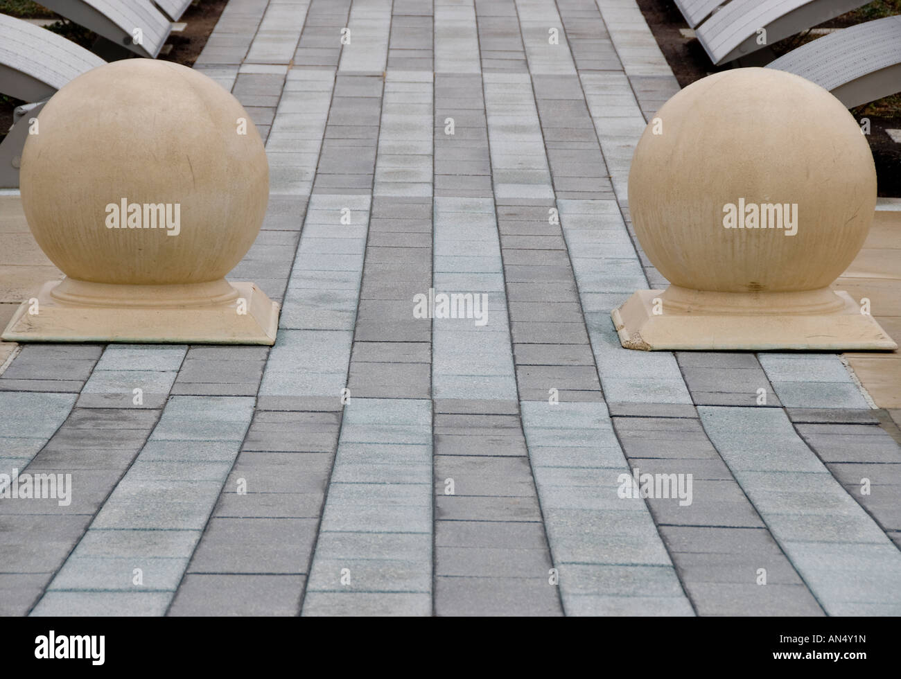 Architectural abstract of large bollards in the shape of radar domes and a paved walkway Stock ...