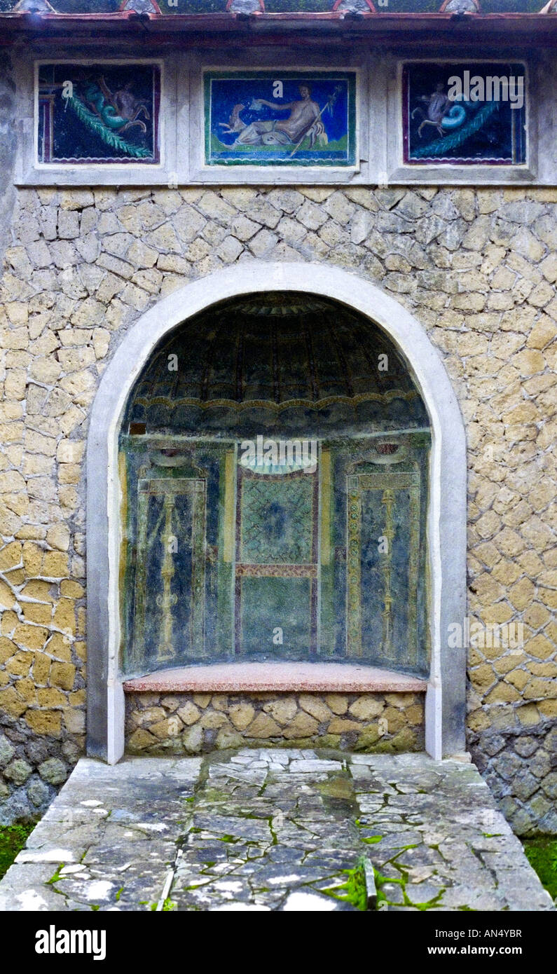 Ancient Roman ruins at Pompeii Italy, a small alcove decorated with a ...