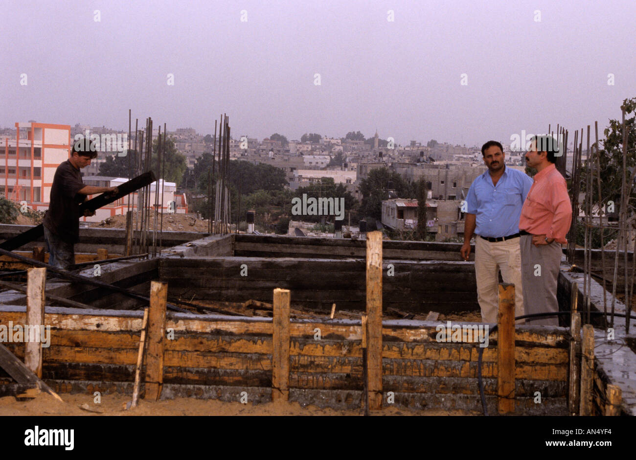 The construction of a building in a city Gaza Strip Stock Photo - Alamy