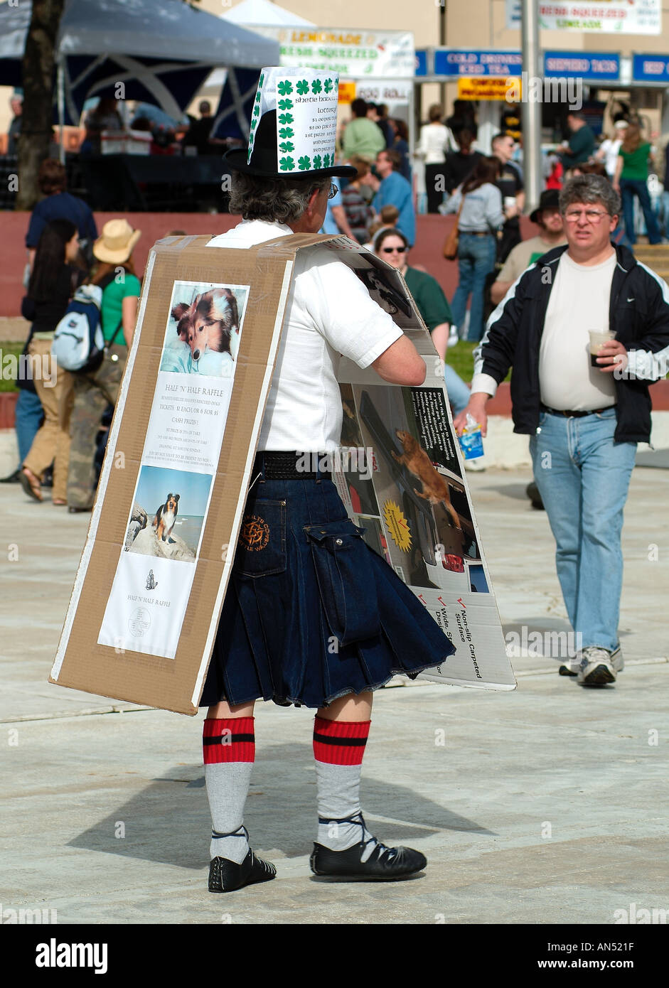 Man walking in the street and wearing ads Stock Photo - Alamy