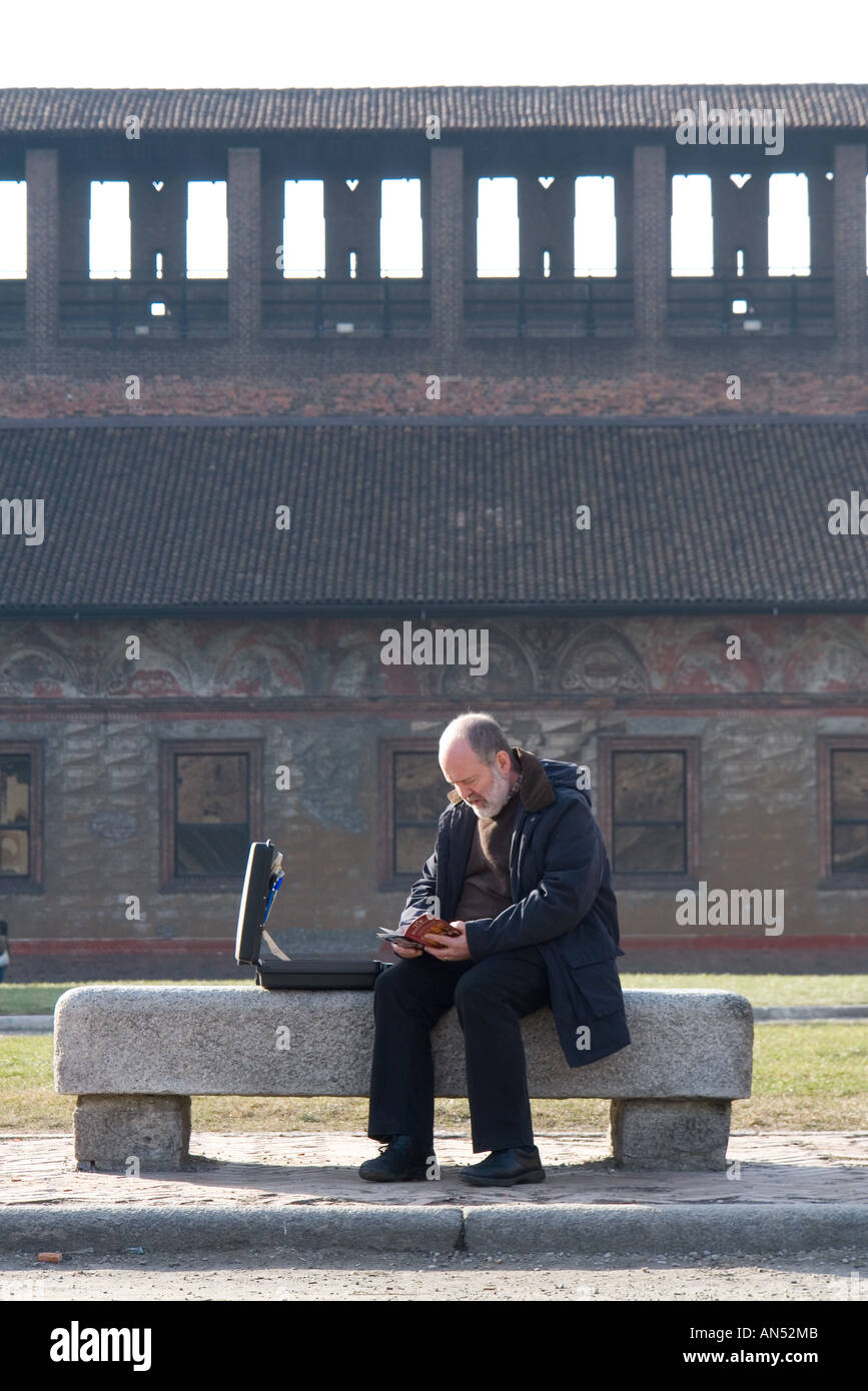 man on bench in castello sforzesco milano Stock Photo - Alamy