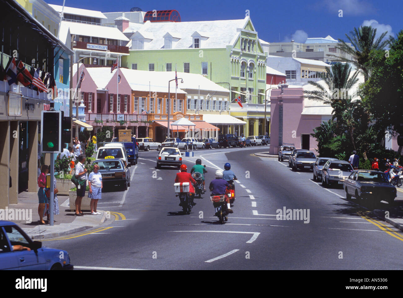 Riding scooters on Front Street Hamilton Bermuda street Stock Photo - Alamy