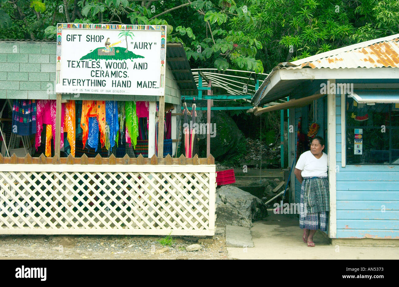 A lady in Roatan Honduras tends a craft shop in the village Stock Photo ...