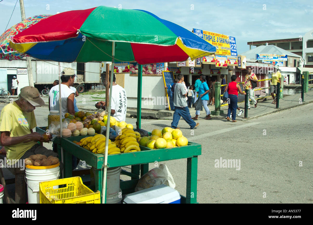 Fruit stand and street scene in Belize City Belize Stock Photo - Alamy