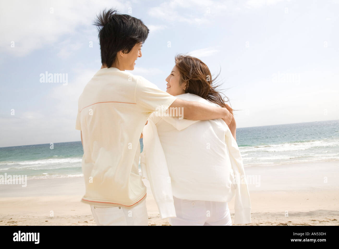 Woman embraced lover's arm Stock Photo - Alamy