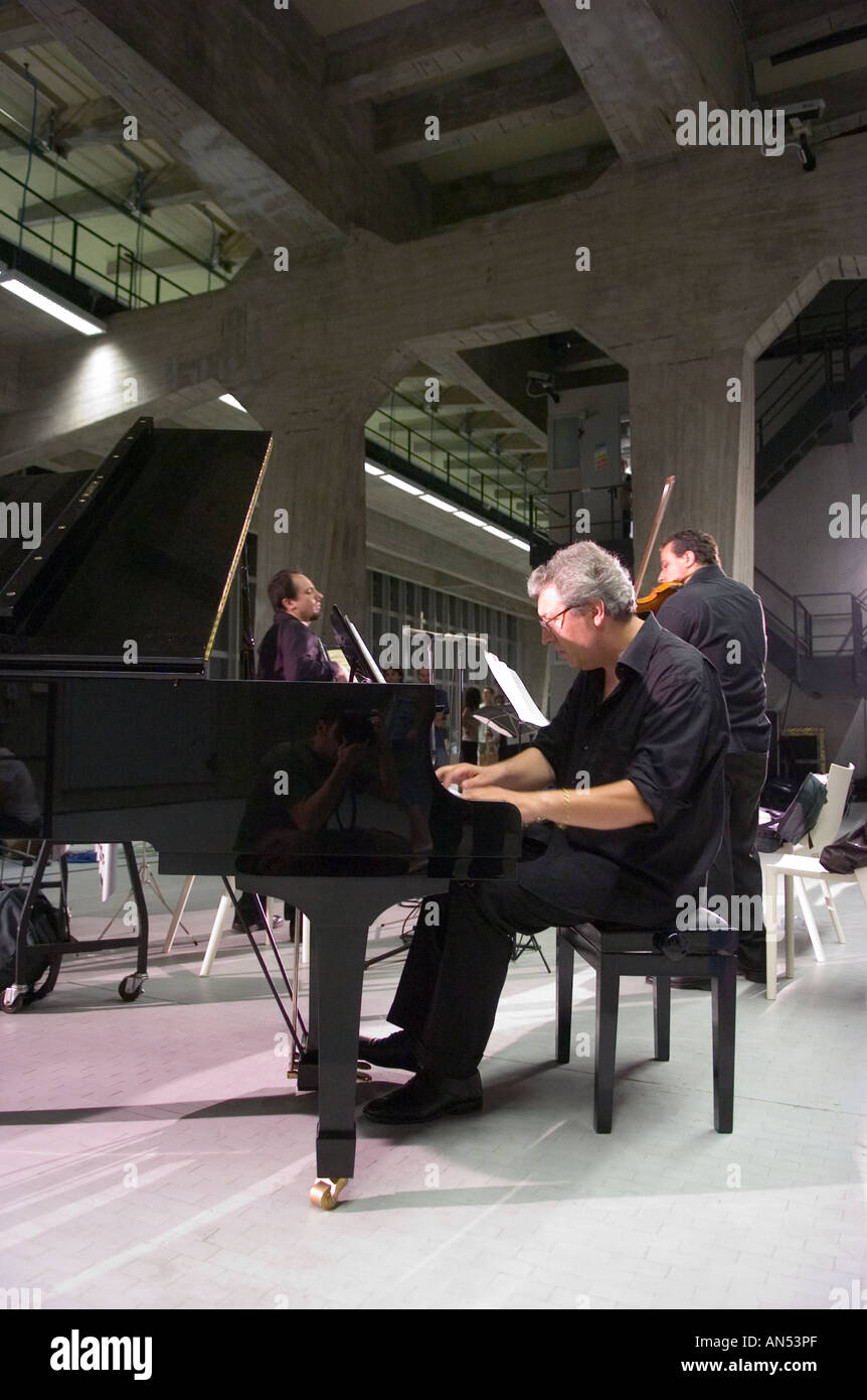 piano classical concert on top of pirelli building at night in milan ...