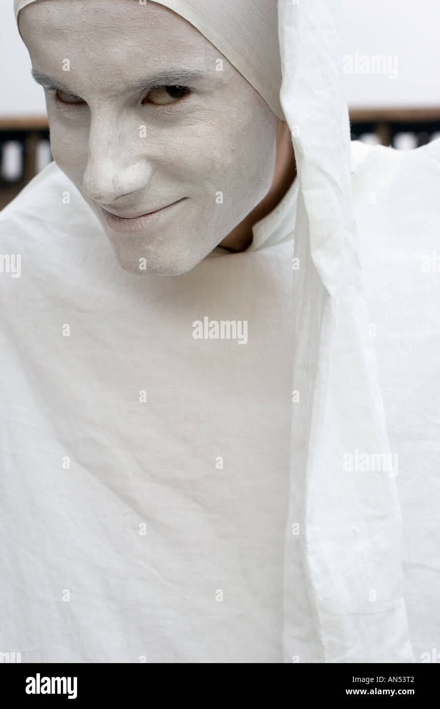 portrait of street artist pretending to be a statue staring Stock Photo ...