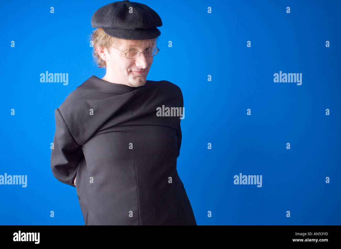 man with black jacket backwards Stock Photo - Alamy