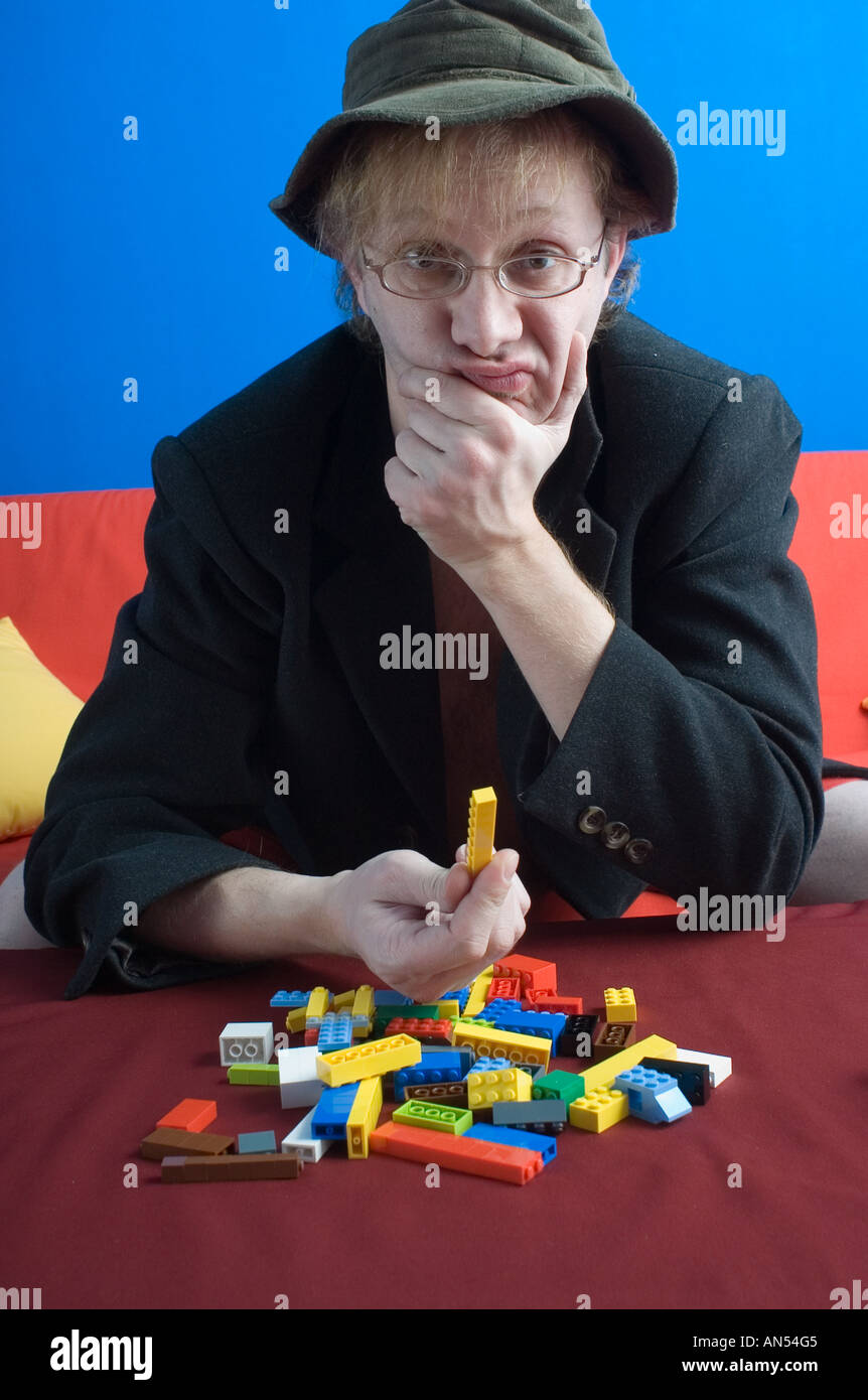man playing with lego Stock Photo - Alamy