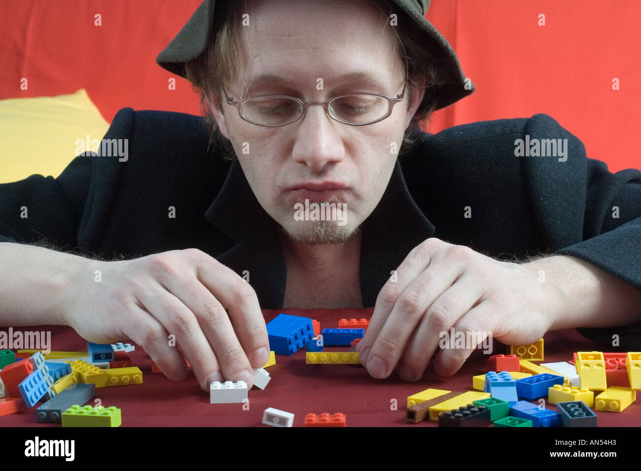 man playing with lego Stock Photo - Alamy