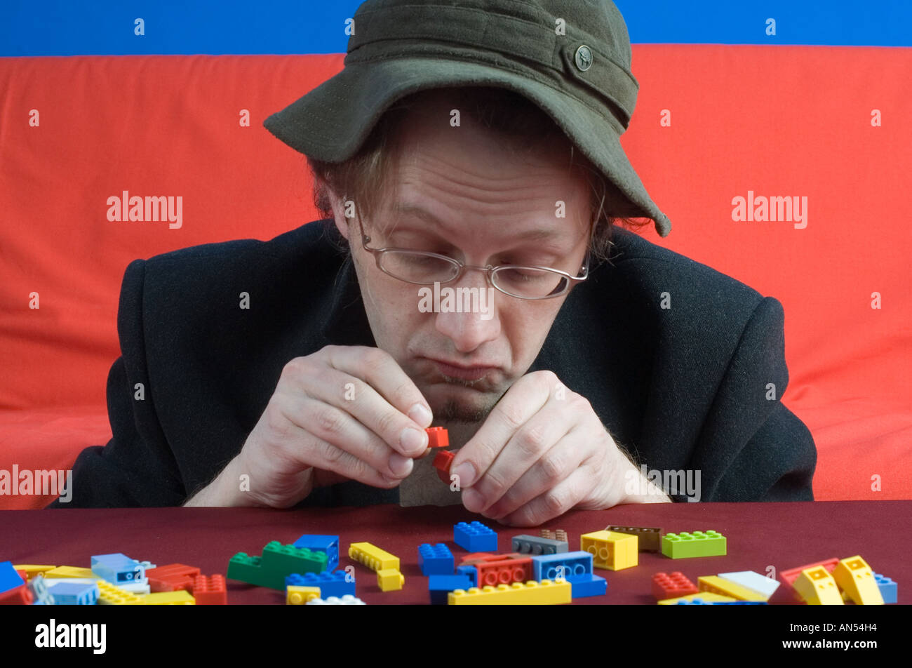 man playing with lego Stock Photo - Alamy