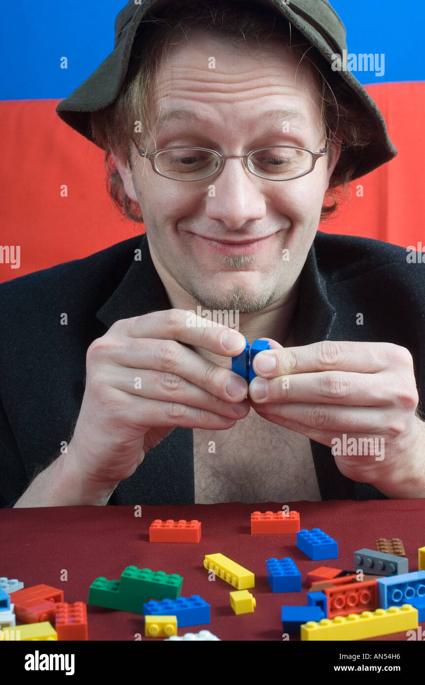 man playing with lego Stock Photo - Alamy