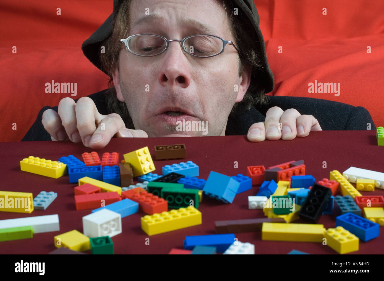 man playing with lego Stock Photo - Alamy