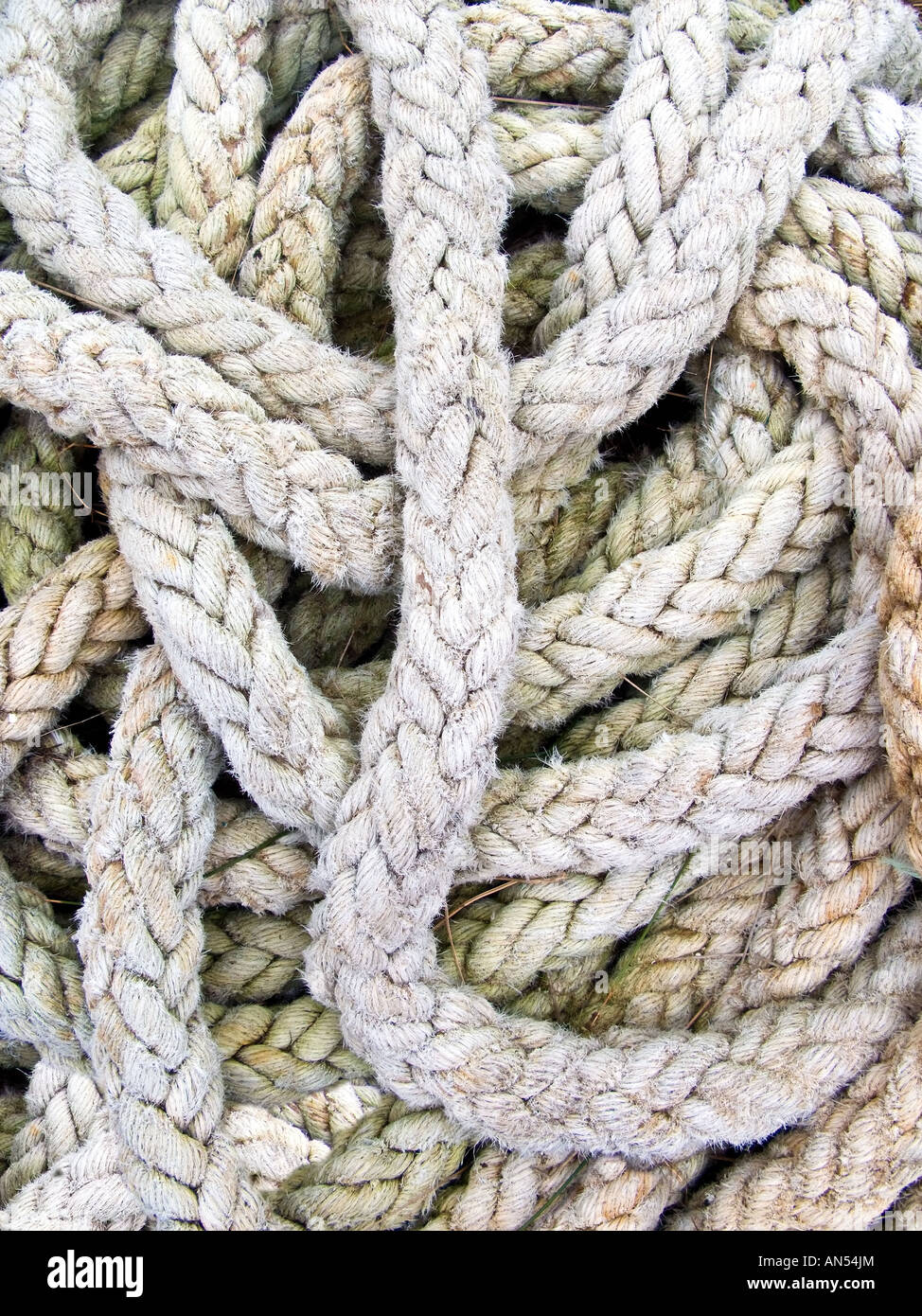 pile of used and old thick ship ropes Stock Photo - Alamy