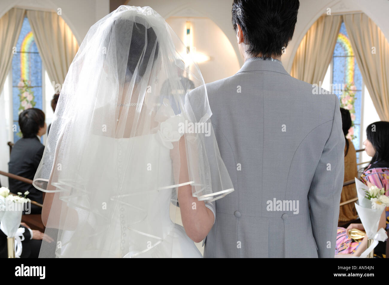 Back figure of bridal couple Stock Photo - Alamy