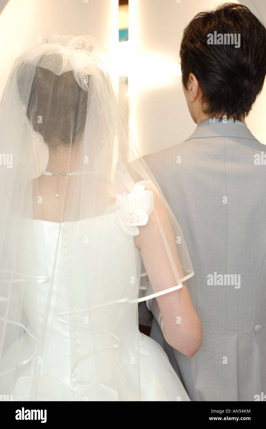 Back figure of bridal couple Stock Photo - Alamy