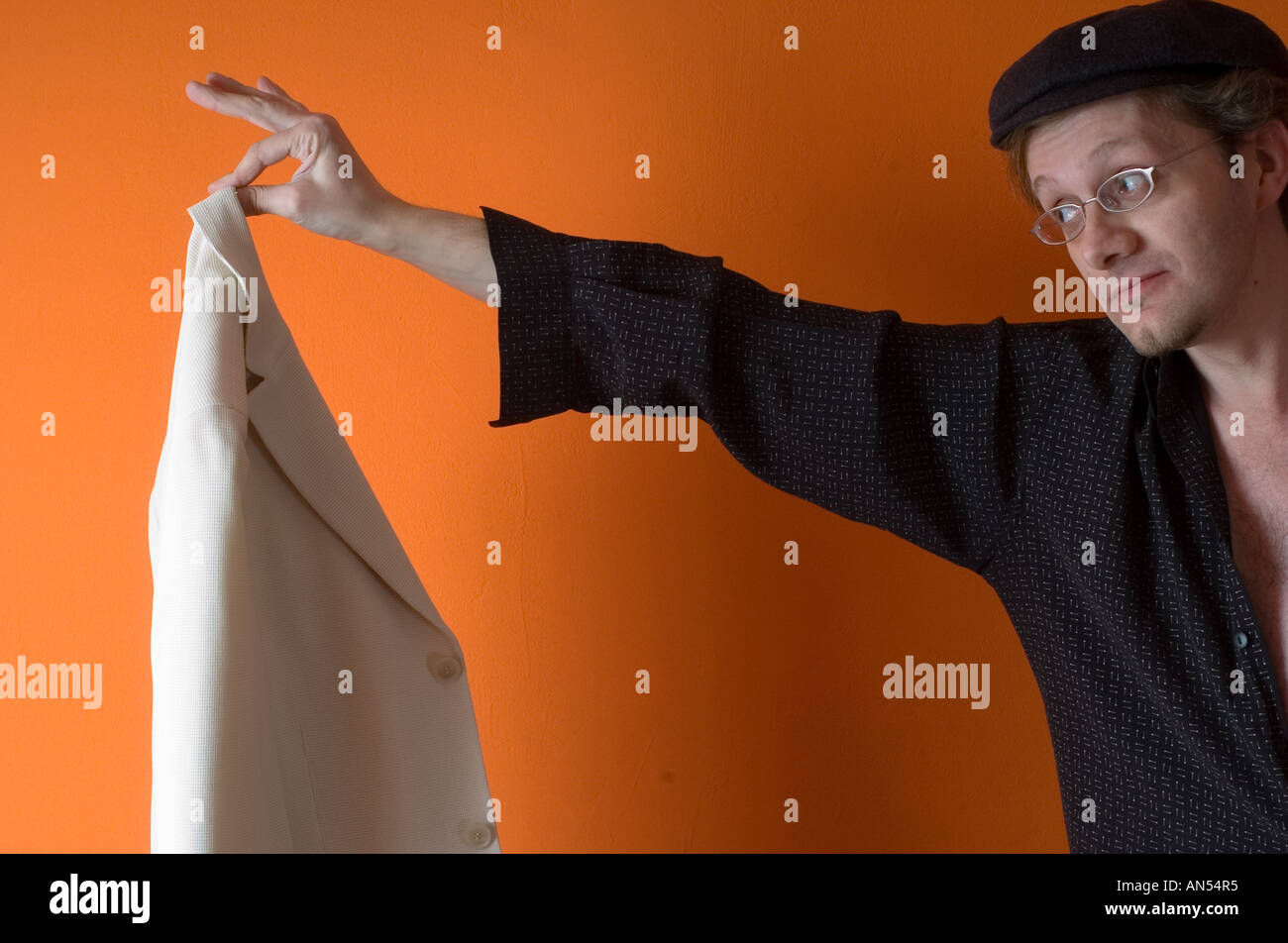 man dropping jacket Stock Photo - Alamy