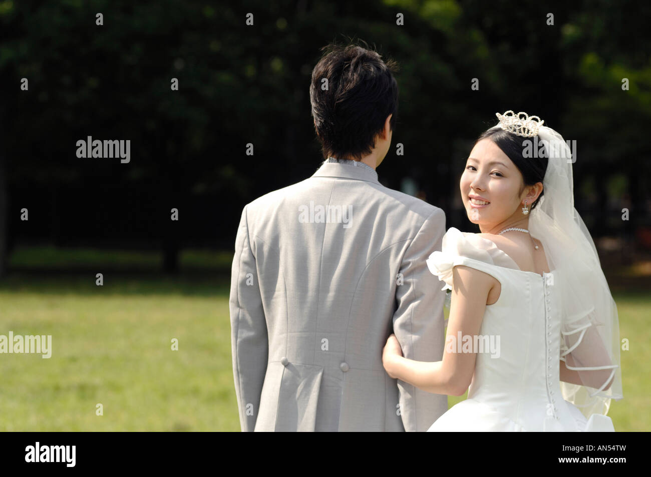 Back figure of bridal couple Stock Photo - Alamy