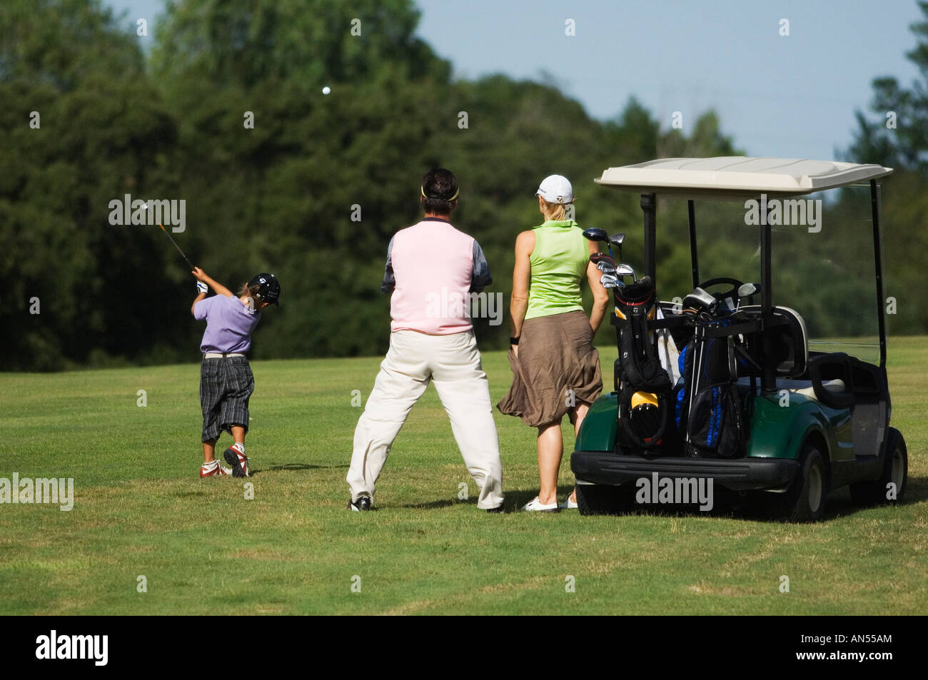 family playing golf Stock Photo - Alamy